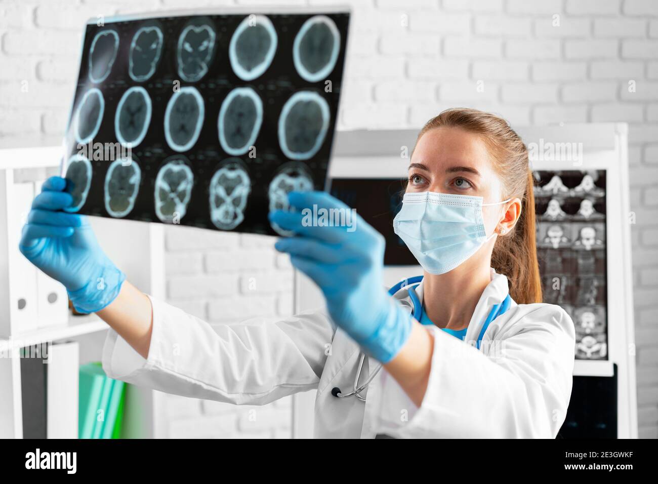 Woman doctor examines head mri scan in hospital Stock Photo - Alamy