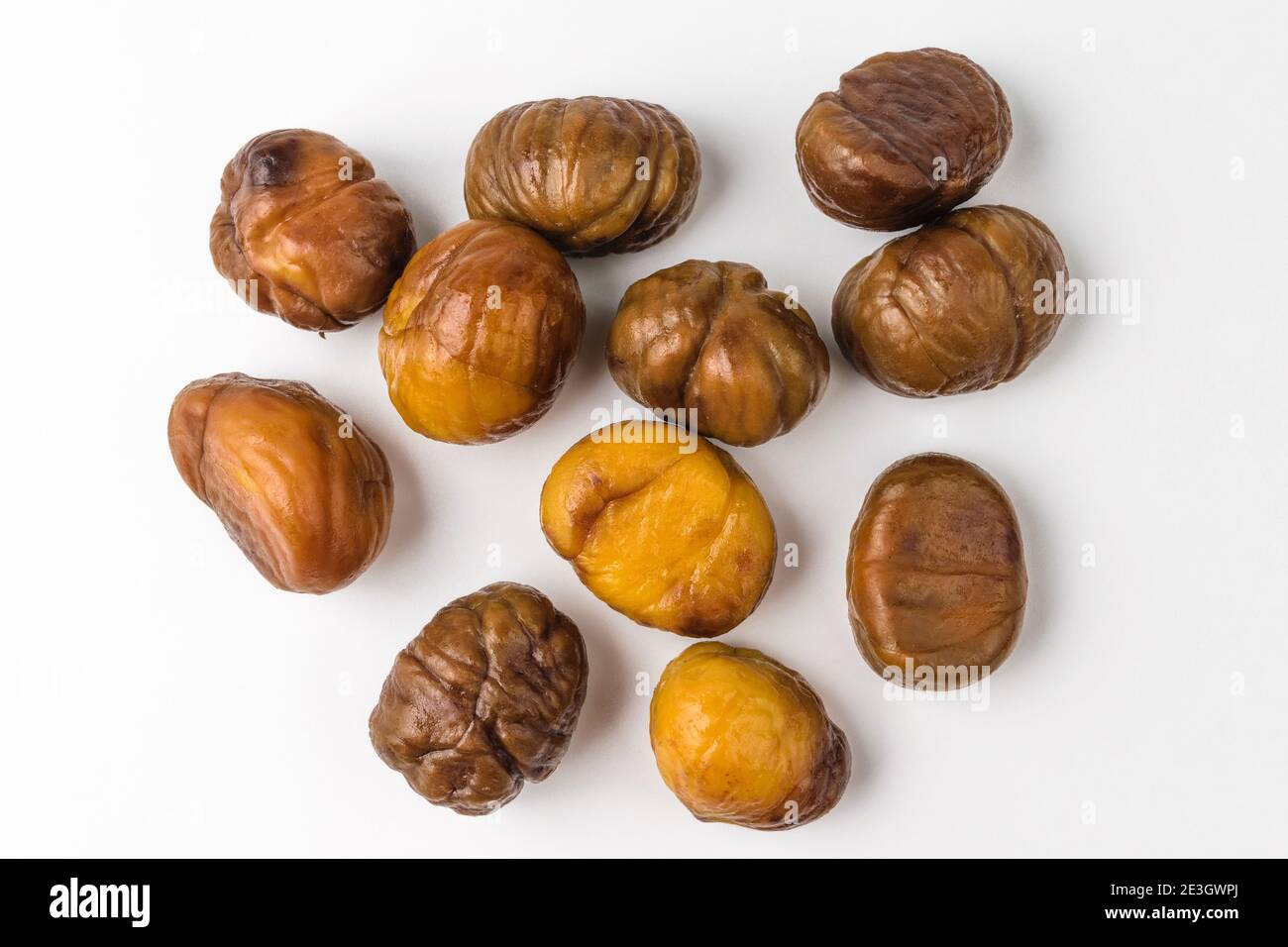 Roasted chestnuts on a white background Stock Photo - Alamy