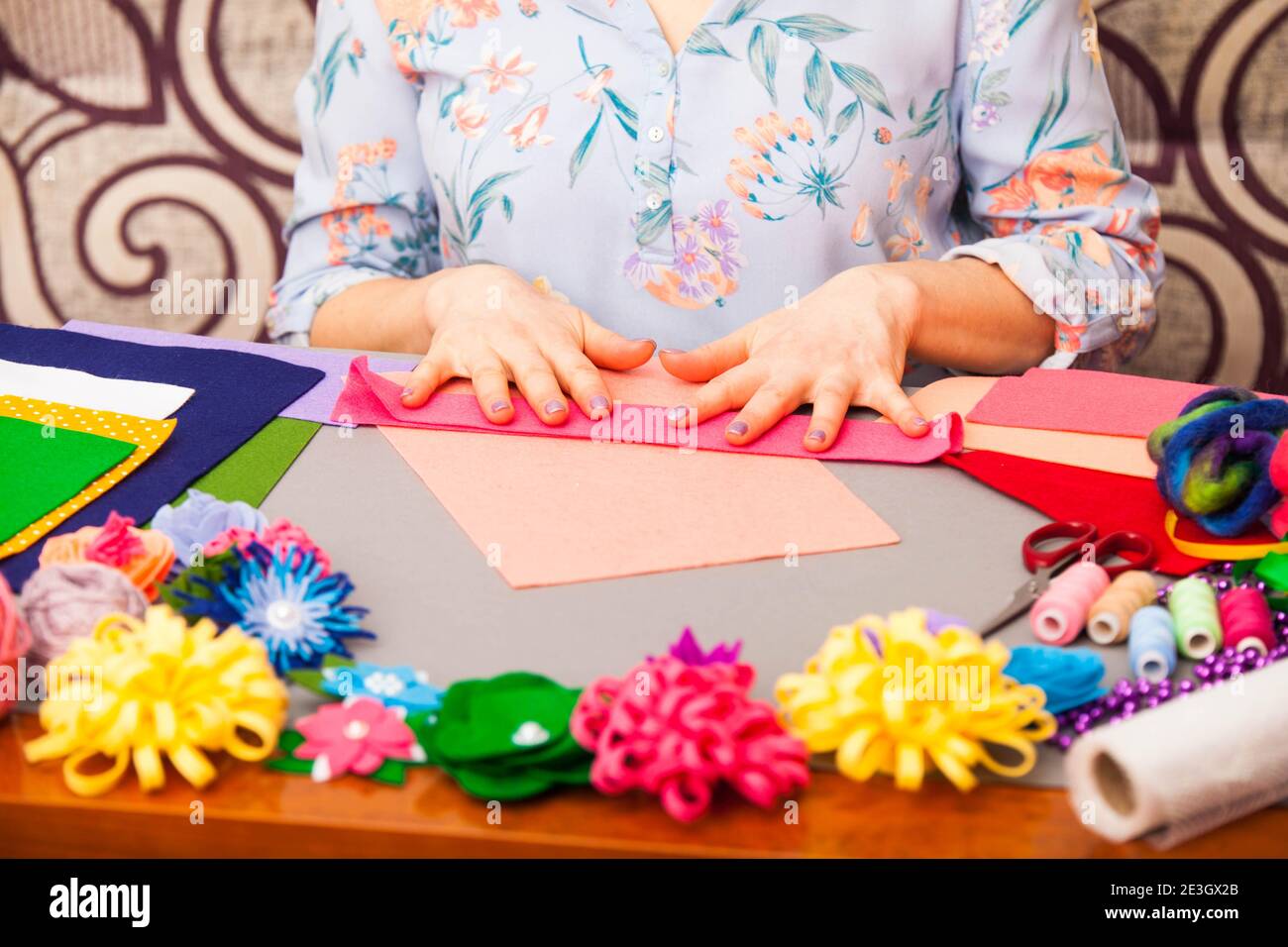 Woman modelling artificial flower from clay Stock Photo - Alamy