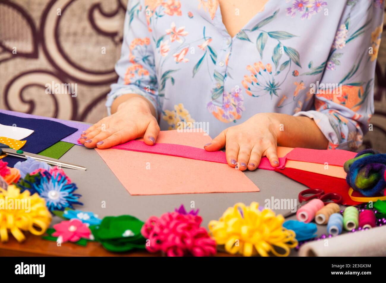 Woman modelling artificial flower from clay Stock Photo - Alamy