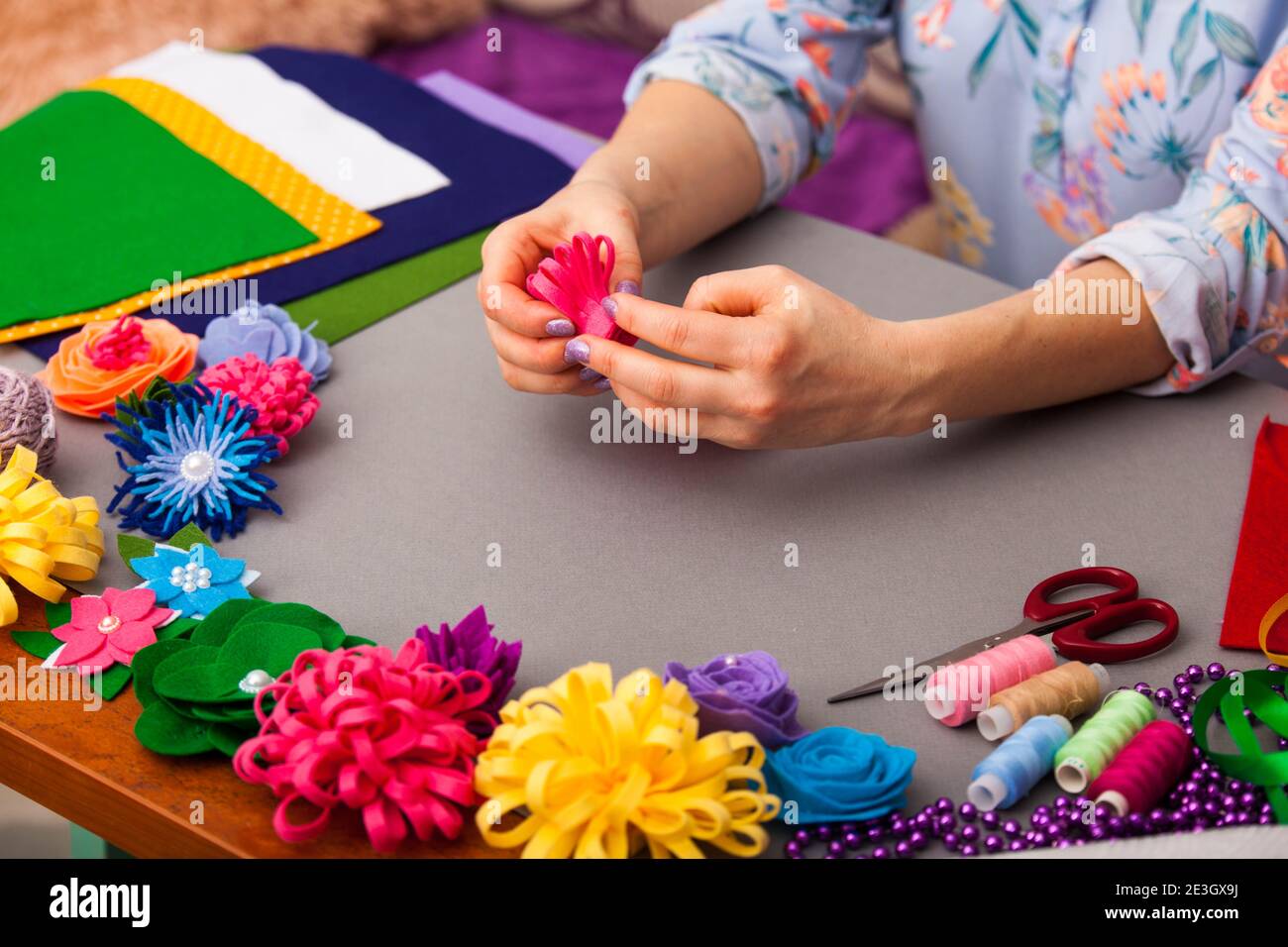 Woman modelling artificial flower from clay Stock Photo - Alamy