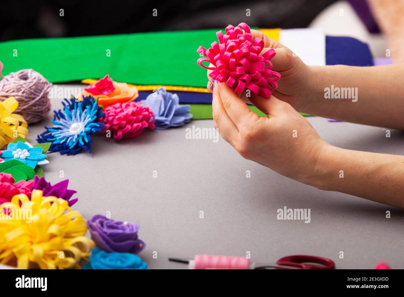 Woman modelling artificial flower from clay Stock Photo - Alamy