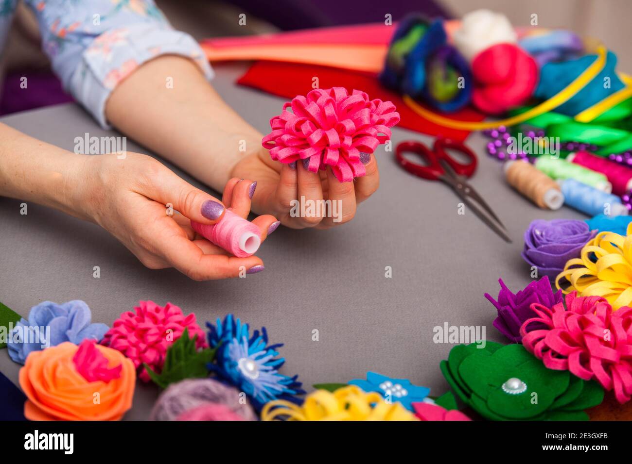Woman modelling artificial flower from clay Stock Photo - Alamy