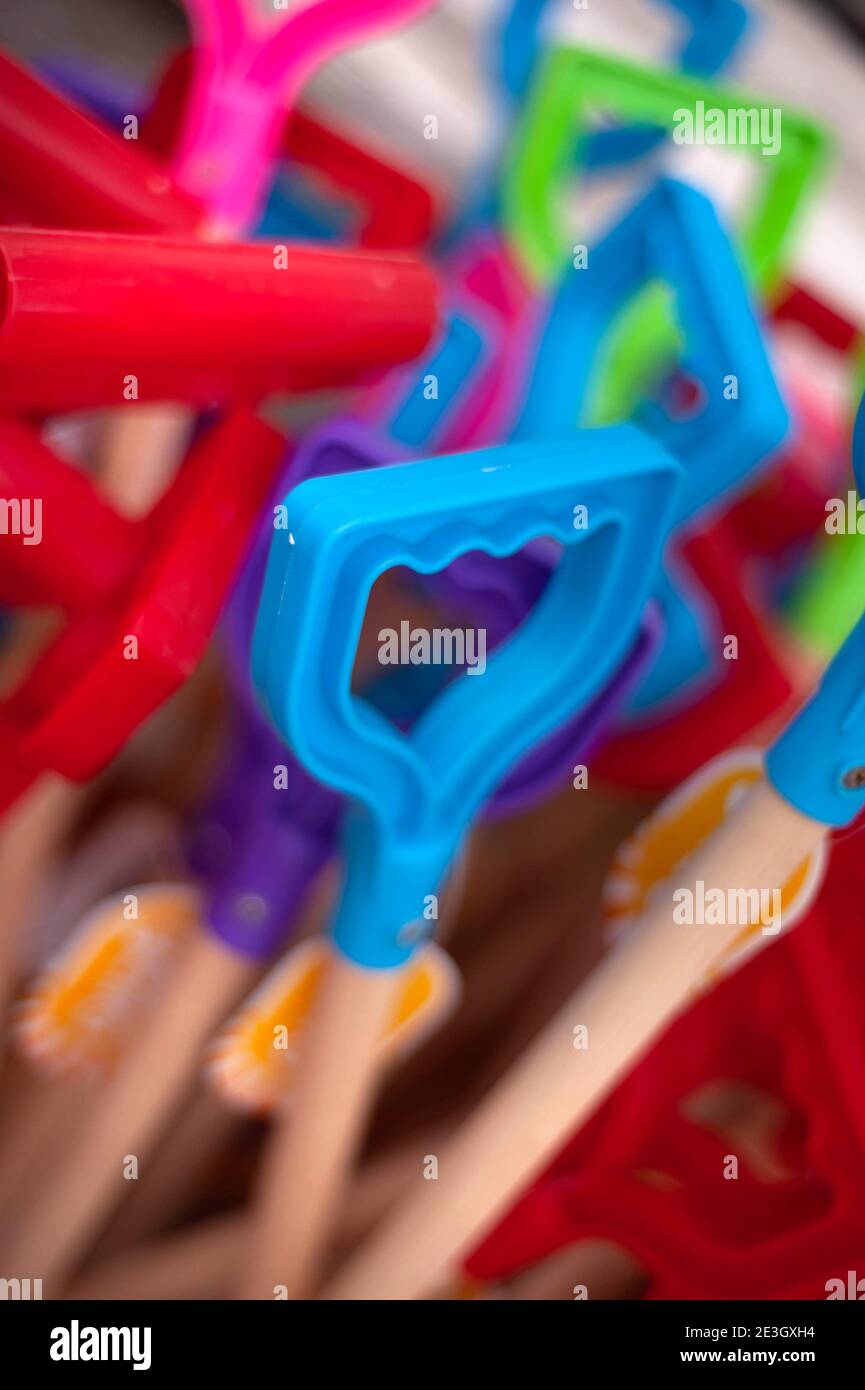 Plastic spades in Seahouses shop, Northumberland Stock Photo - Alamy