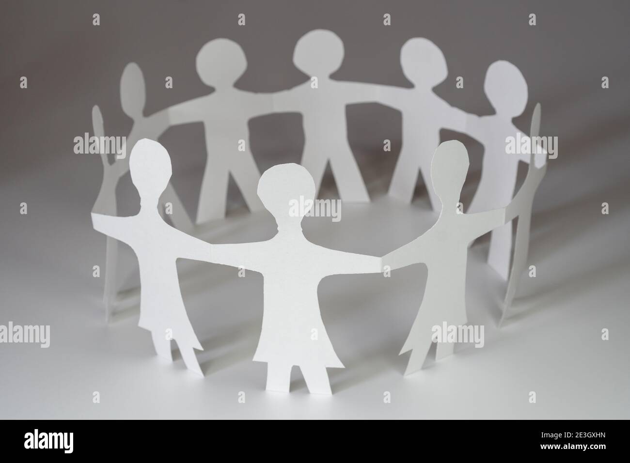 paper people shape cut, connection chain Stock Photo - Alamy