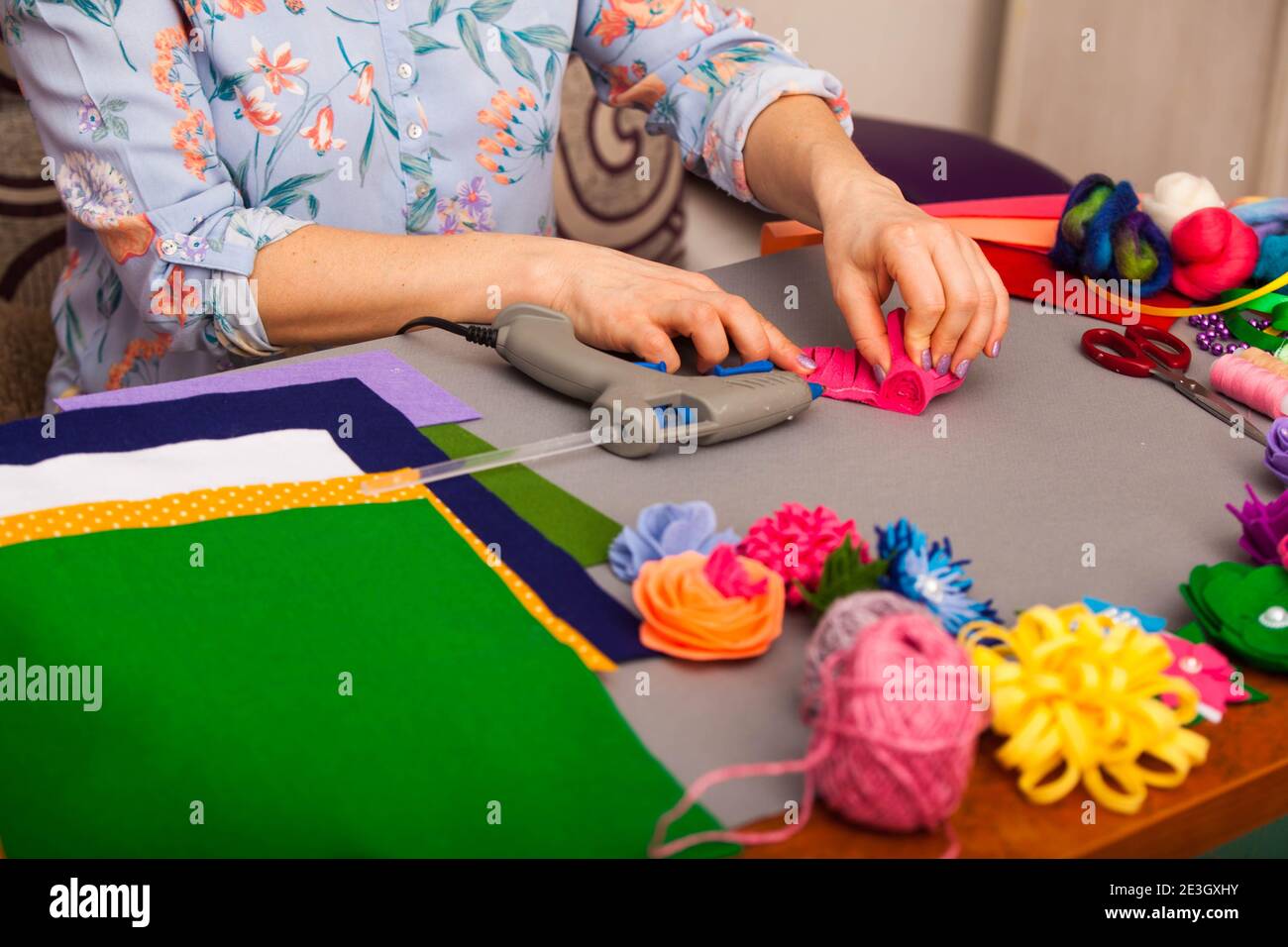 Woman modelling artificial flower from clay Stock Photo - Alamy