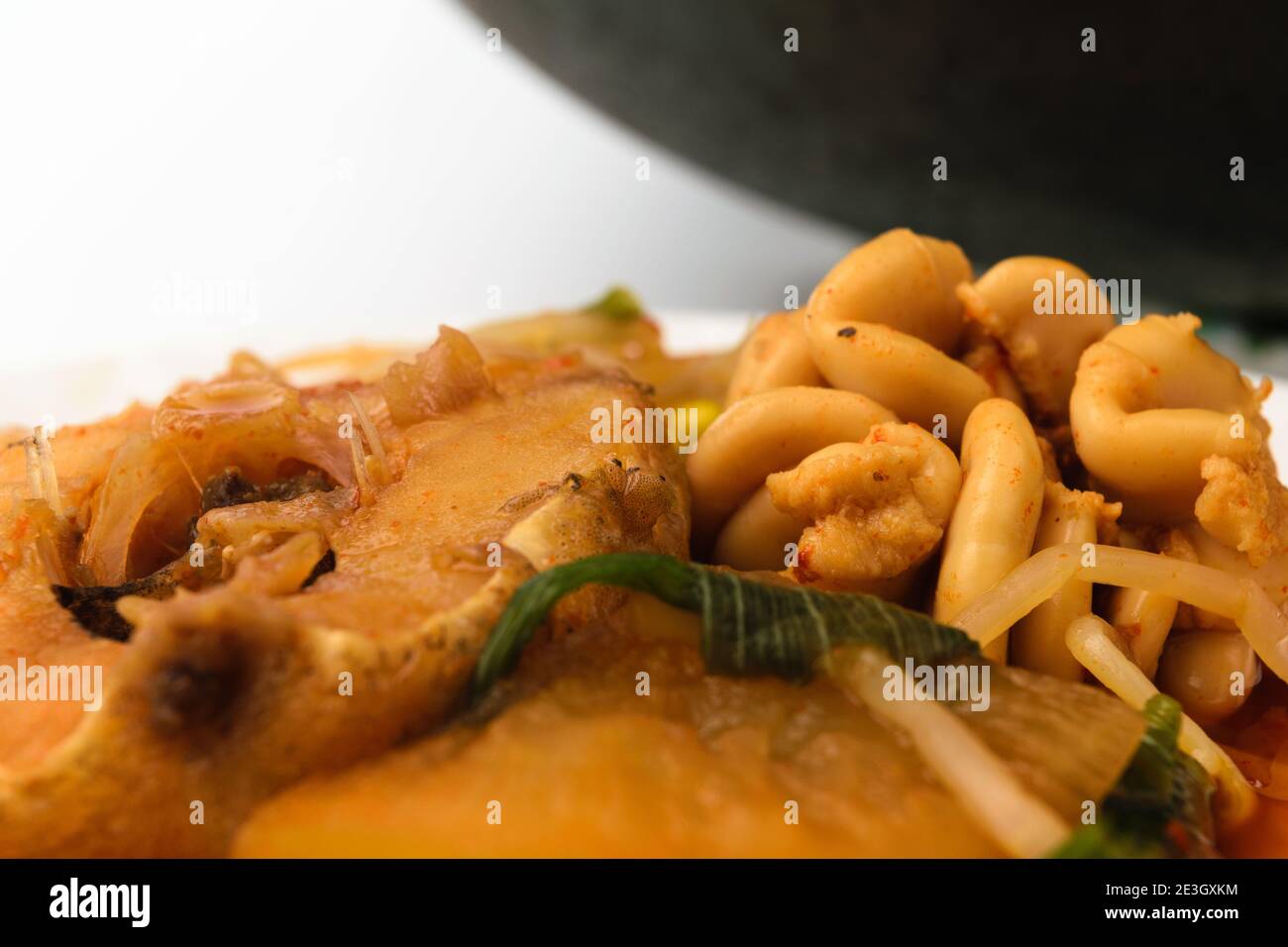 Cooking fish broth on a white background Stock Photo - Alamy