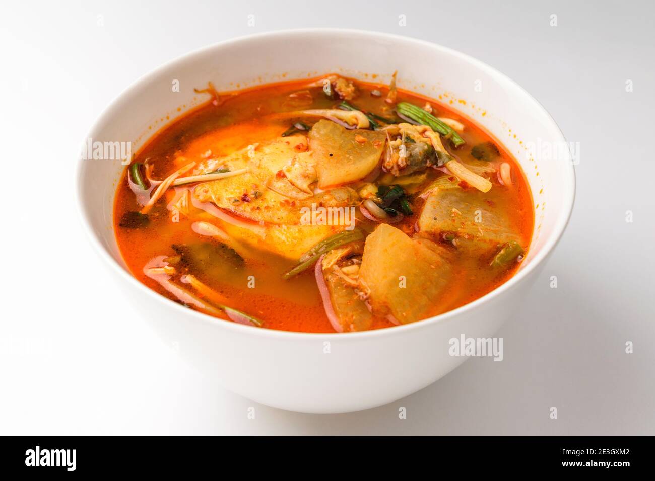 Cooking fish broth on a white background Stock Photo - Alamy