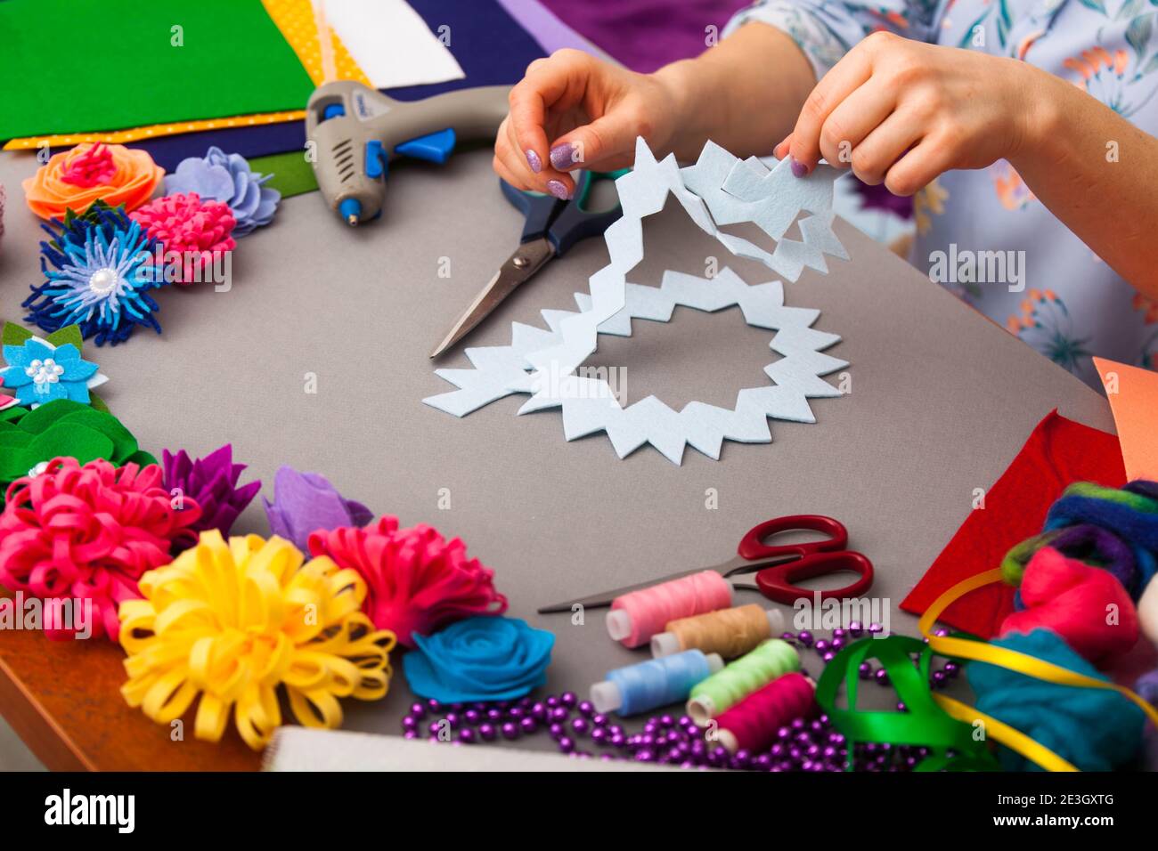 Woman modelling artificial flower from clay Stock Photo - Alamy