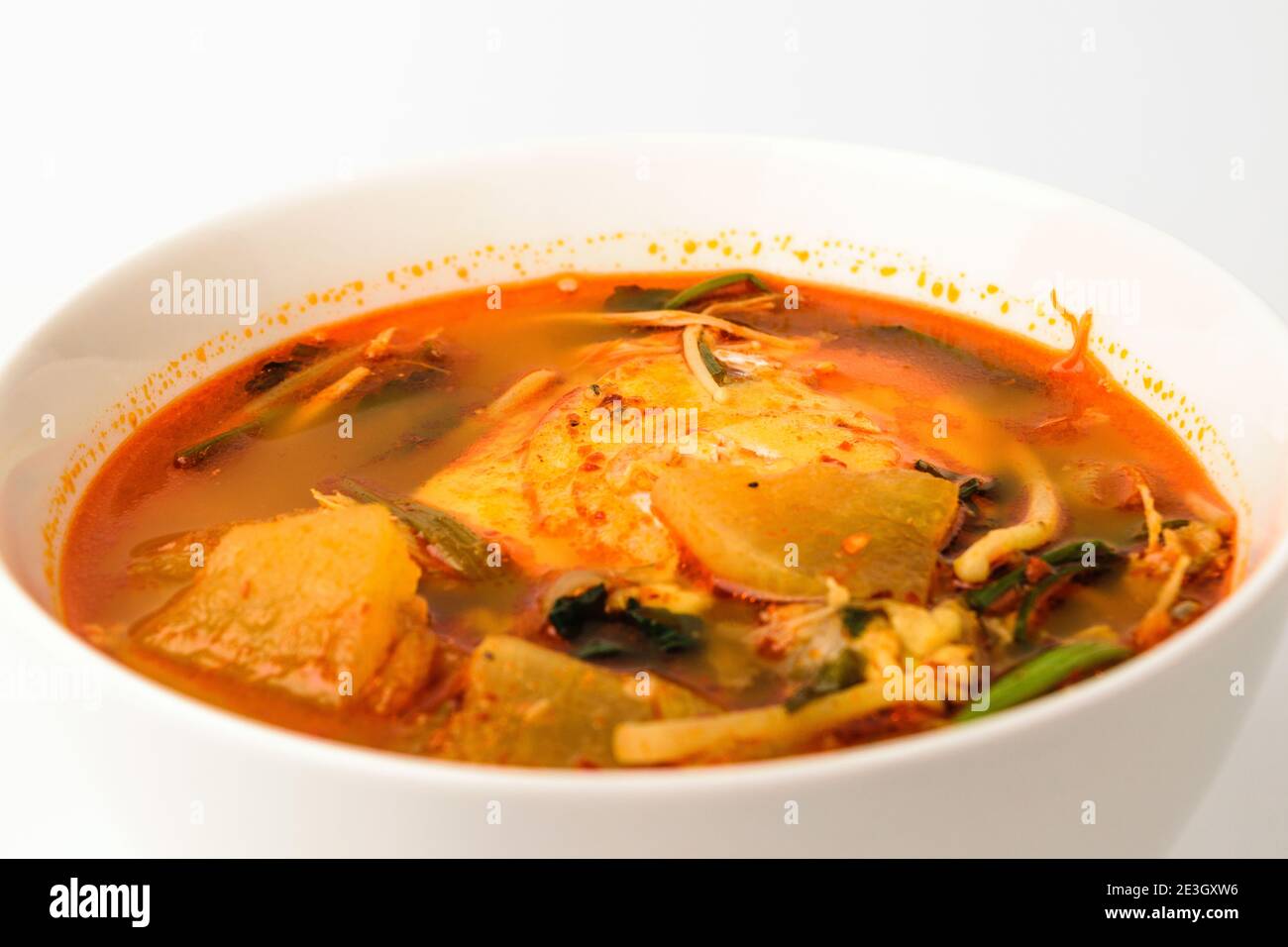 Cooking fish broth on a white background Stock Photo - Alamy