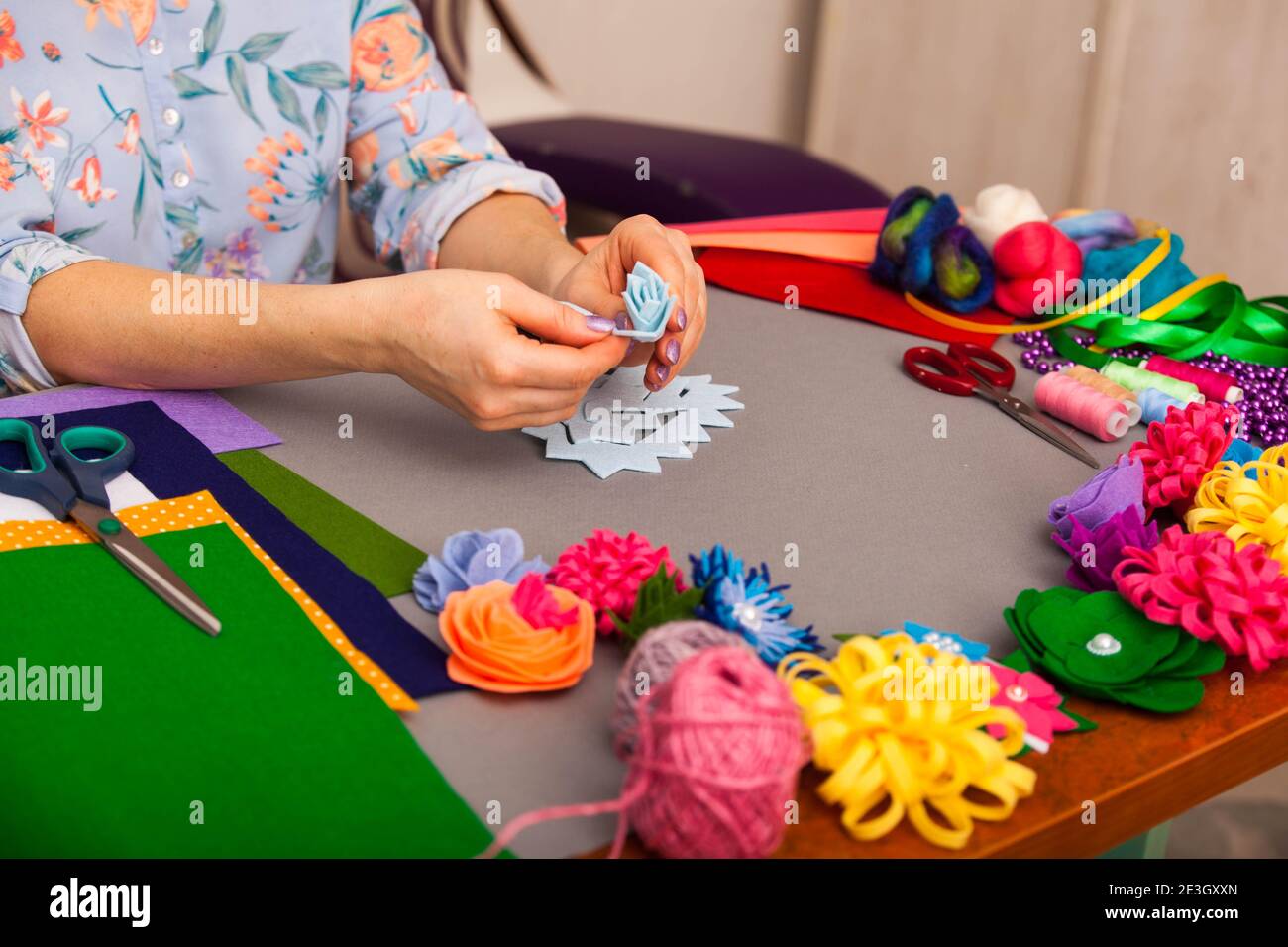 Woman modelling artificial flower from clay Stock Photo - Alamy
