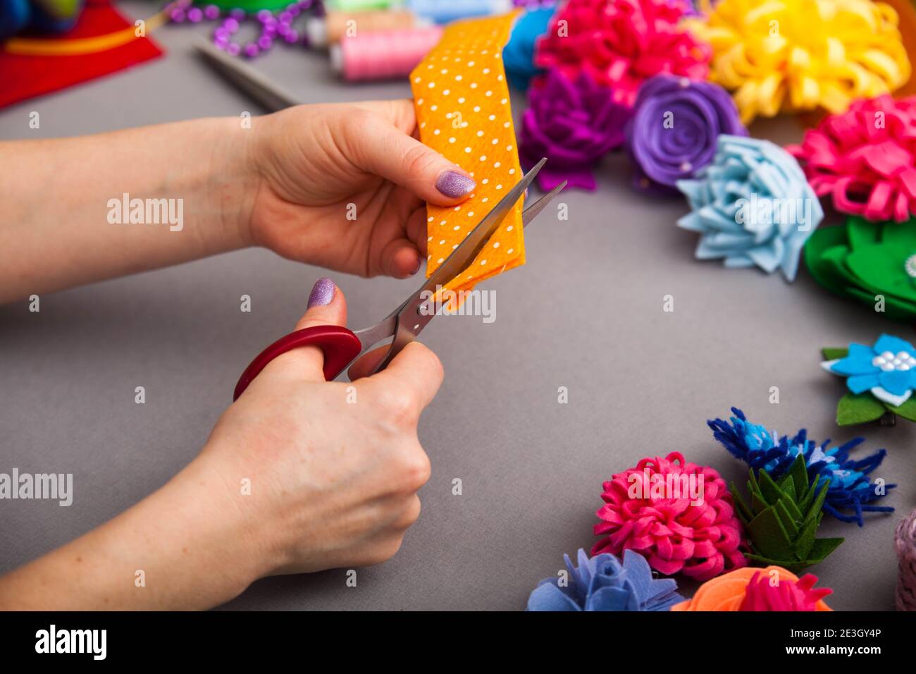 Woman modelling artificial flower from clay Stock Photo - Alamy