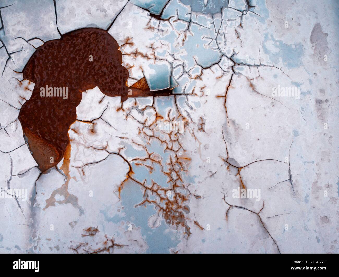 Worn rusty metal surface with paint flaking and cracking texture ...