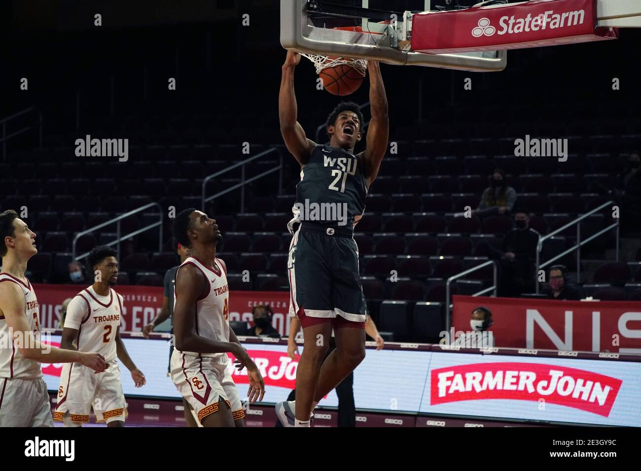 Washington State Cougars center Dishon Jackson (21) dunks the ball over ...