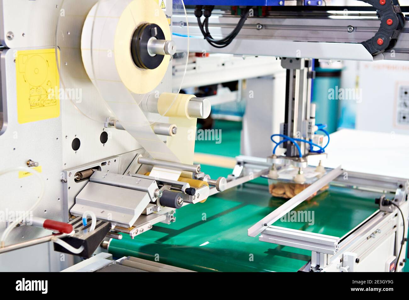 Machine of weighing and labeling lines Stock Photo - Alamy