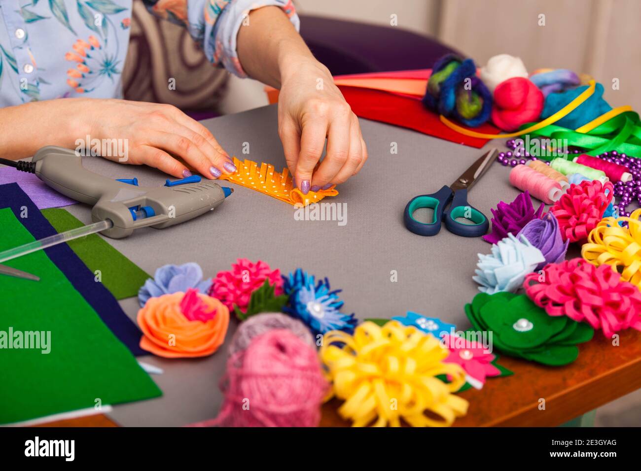 Woman modelling artificial flower from clay Stock Photo - Alamy