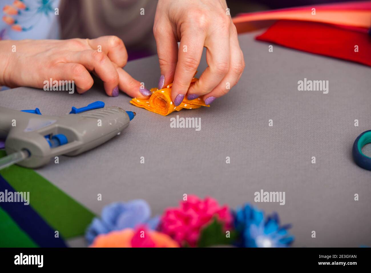 Woman modelling artificial flower from clay Stock Photo - Alamy