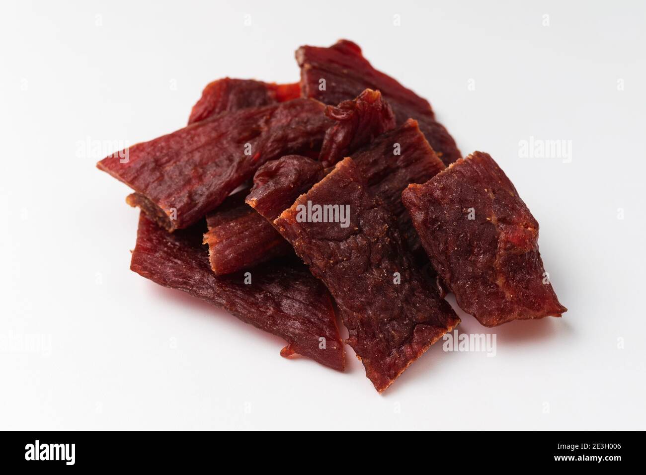 Beef jerky on white background Stock Photo - Alamy