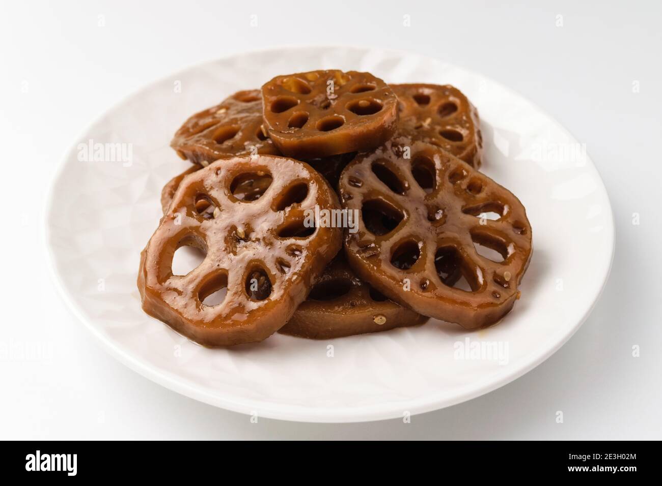Boiled lotus root on a white background Stock Photo - Alamy