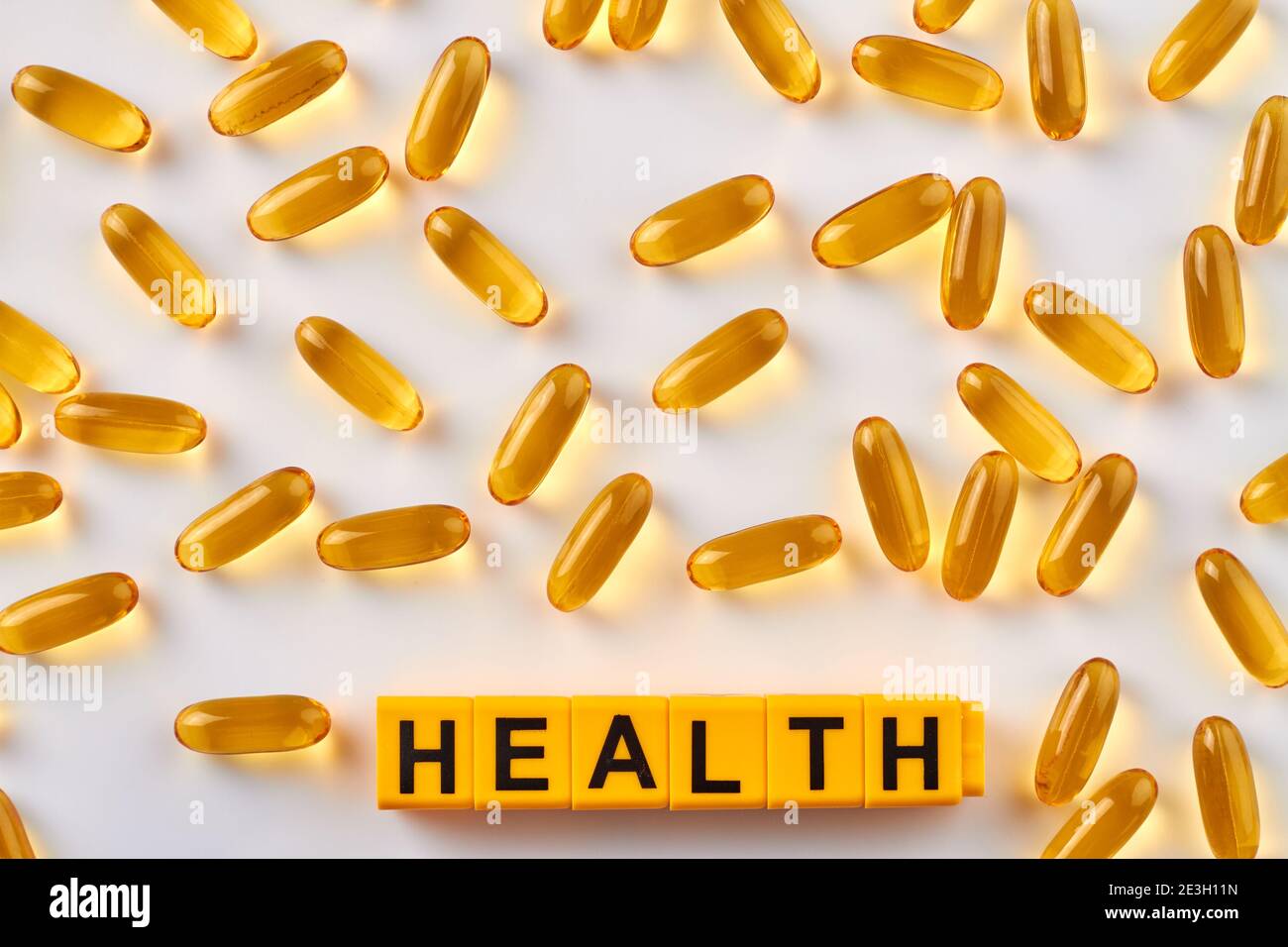 Many yellow capsules Stock Photo - Alamy