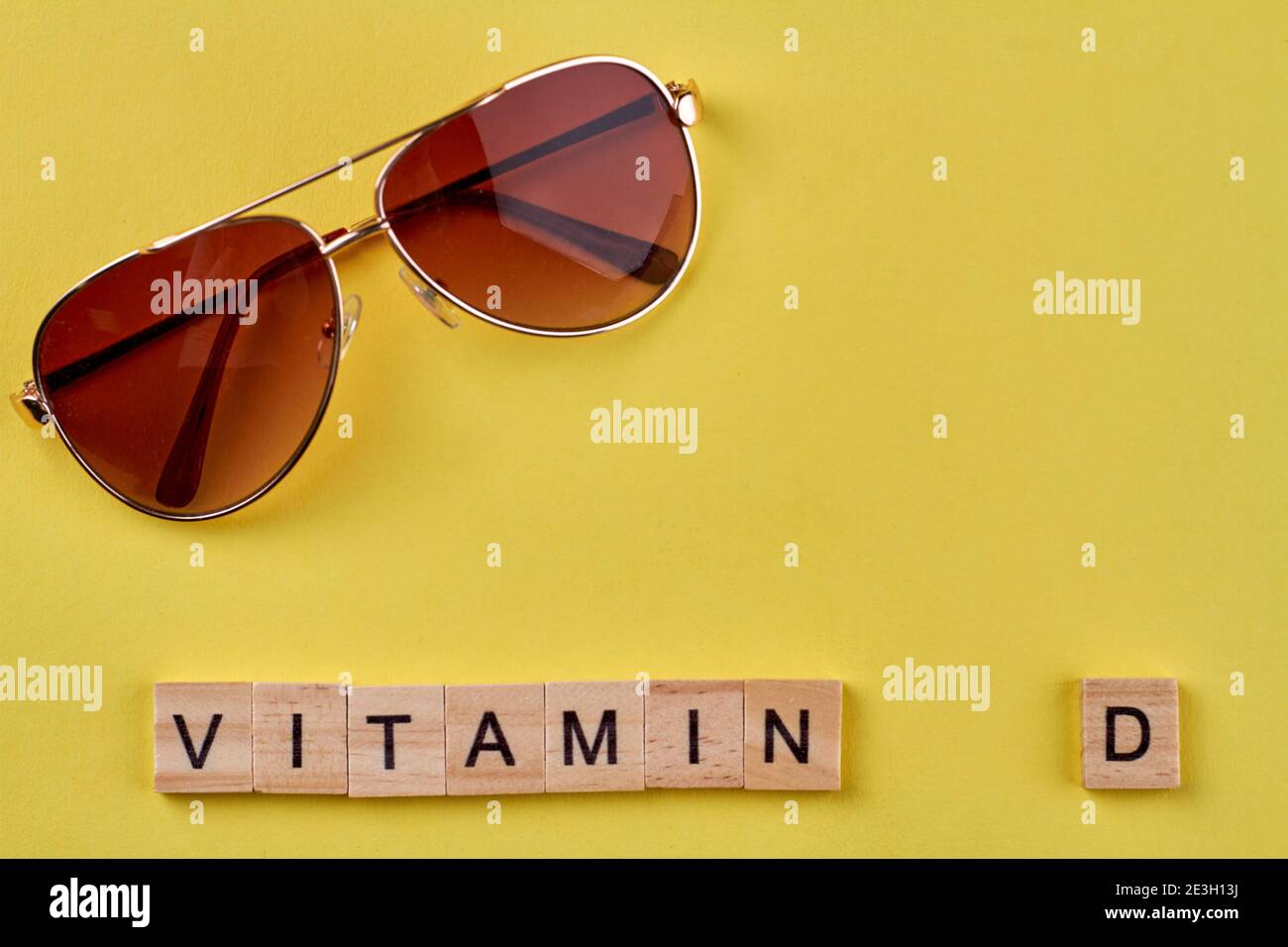 Sunglasses and vitamin d made of wooden blocks Stock Photo - Alamy