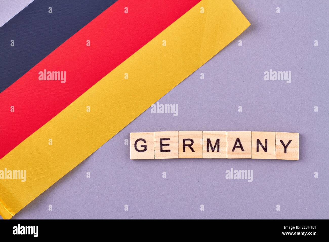 Germany flag on purple background Stock Photo - Alamy