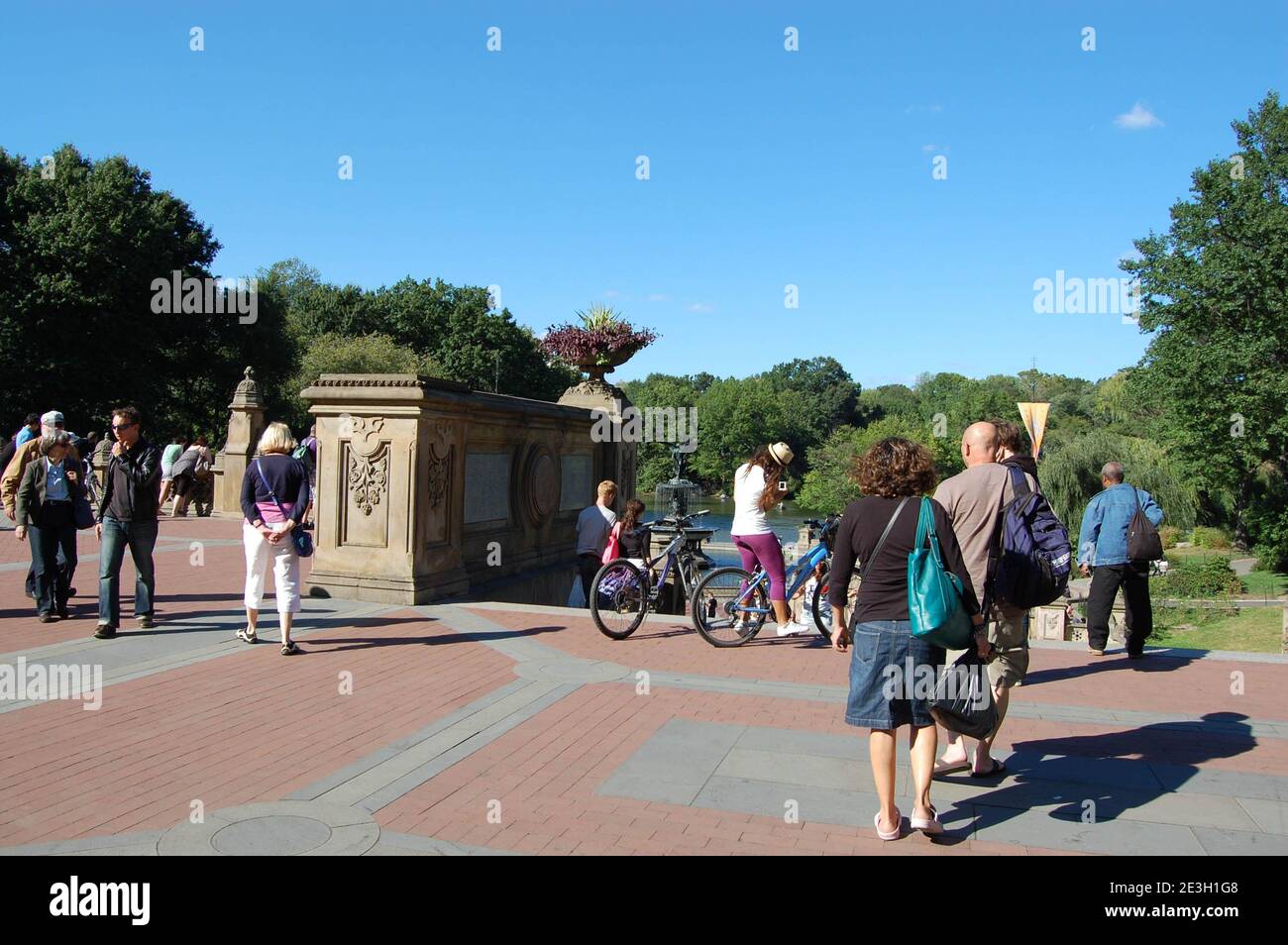 Central Park entrance New York USA people walking and bike or bicycle ...