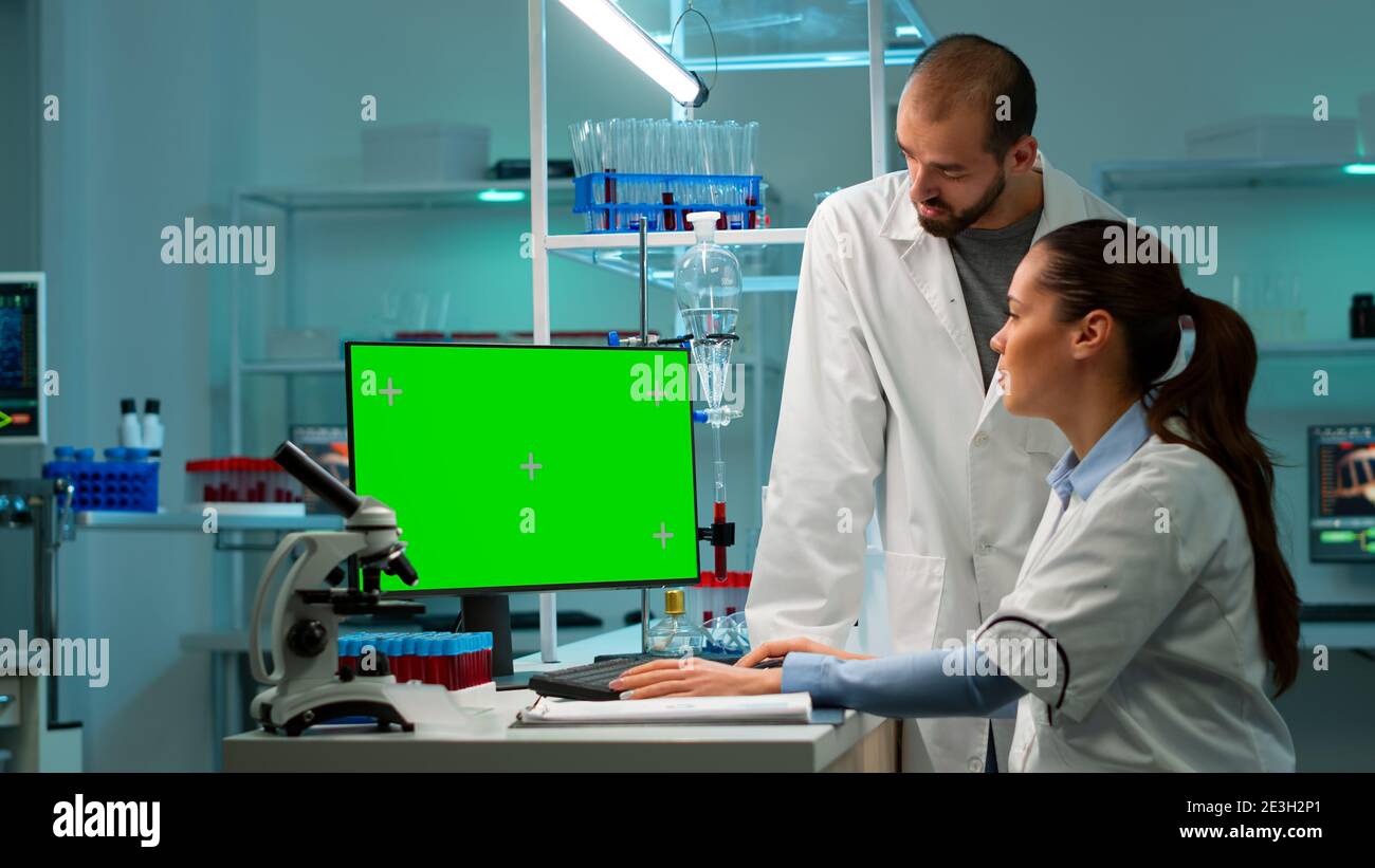 Modern medical research laboratory with two scientists using computer ...