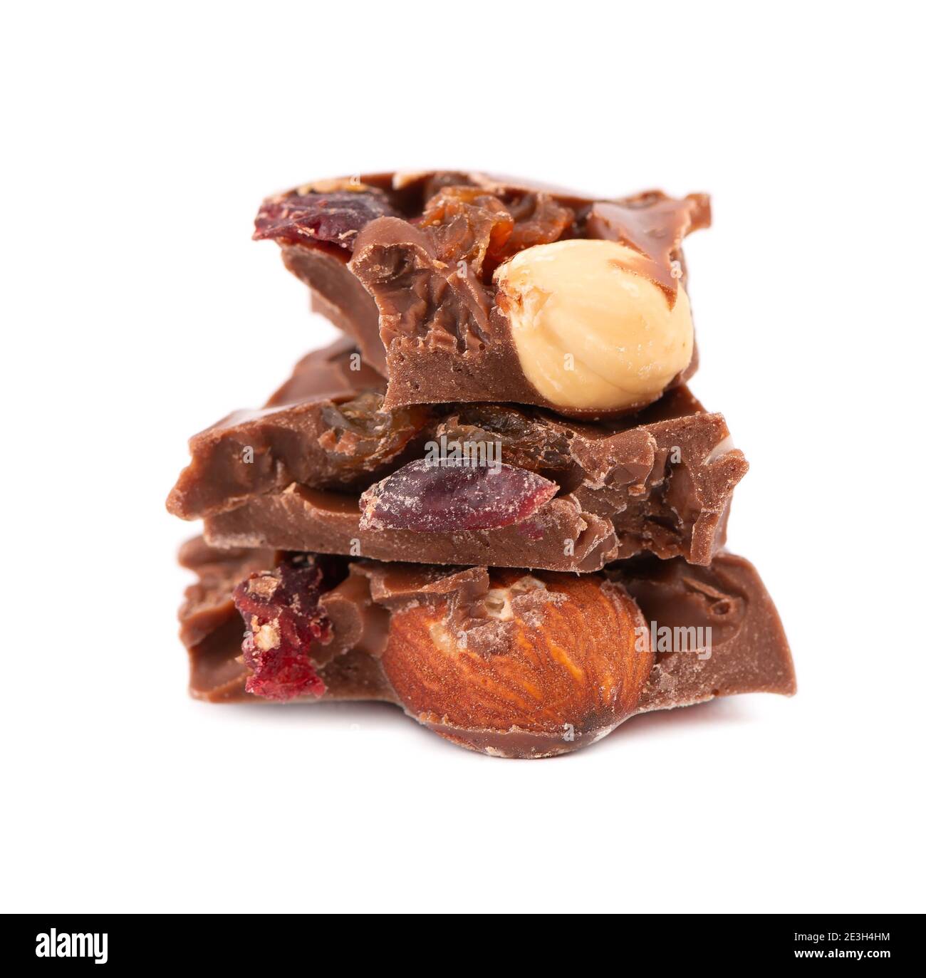 Chocolate pieces stack with nuts and berries, isolated on white ...