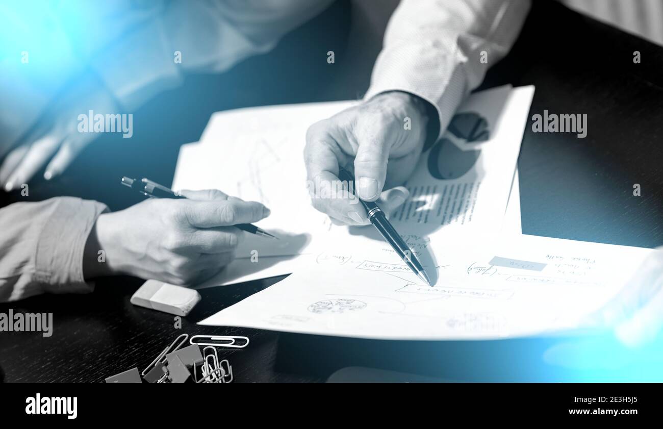 Businesspeople working together in office; light effect Stock Photo - Alamy