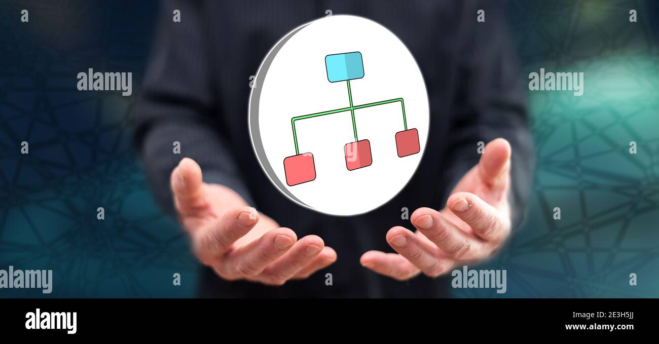 Hierarchy concept above the hands of a man in background Stock Photo ...