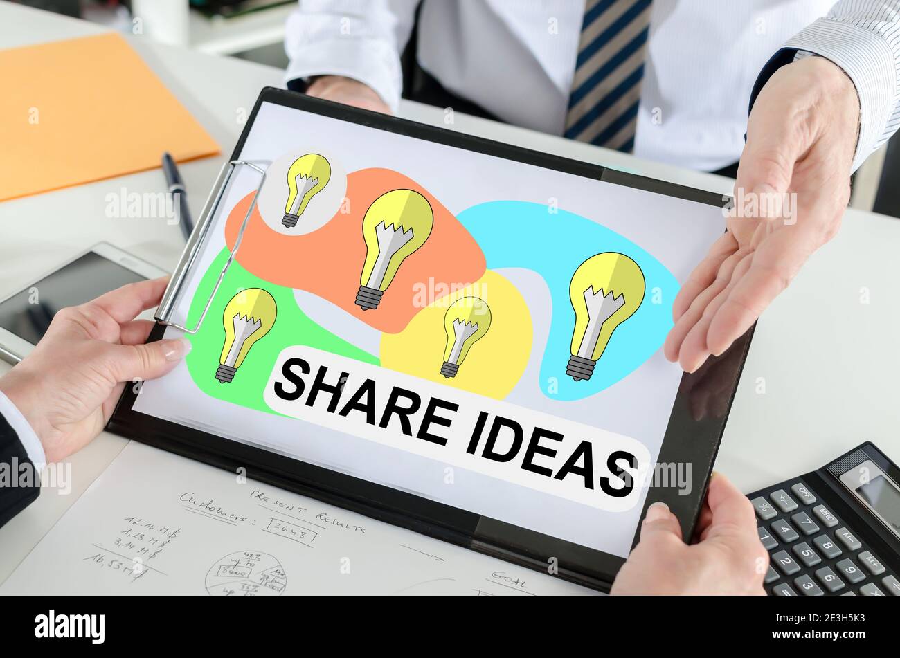 Share ideas concept shown by a businessman Stock Photo - Alamy