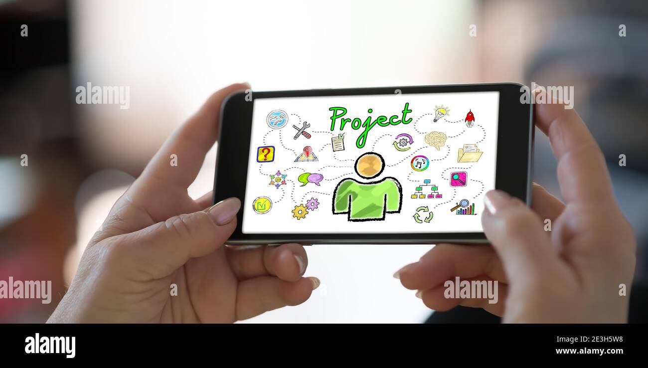 Hand holding a smartphone with project concept Stock Photo - Alamy