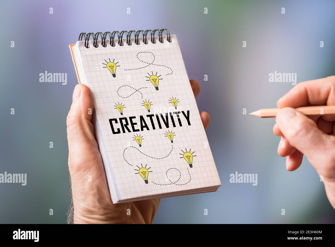 Hand drawing creativity concept on a notepad Stock Photo - Alamy