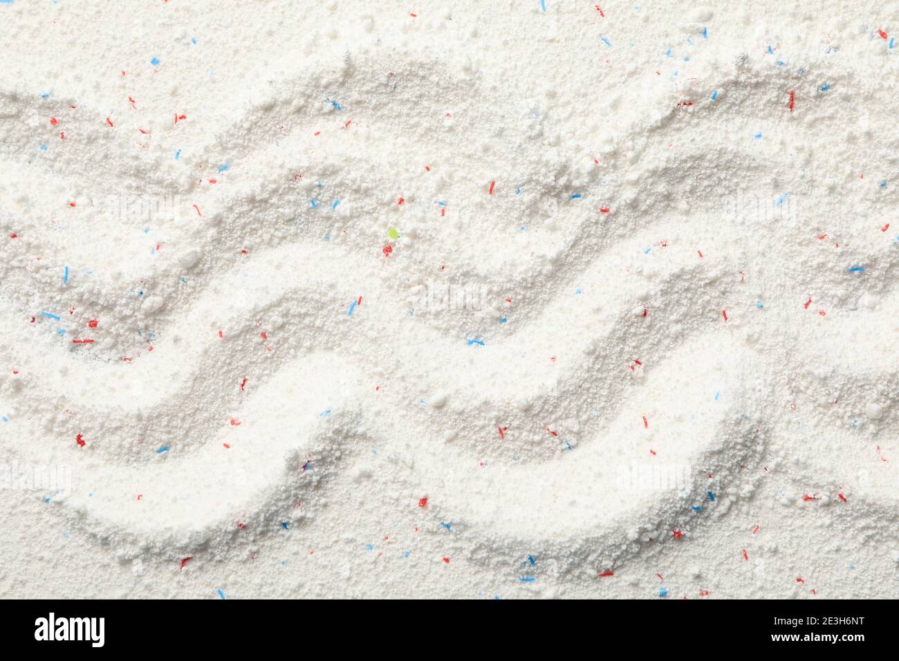 Washing powder with waves on whole background Stock Photo - Alamy