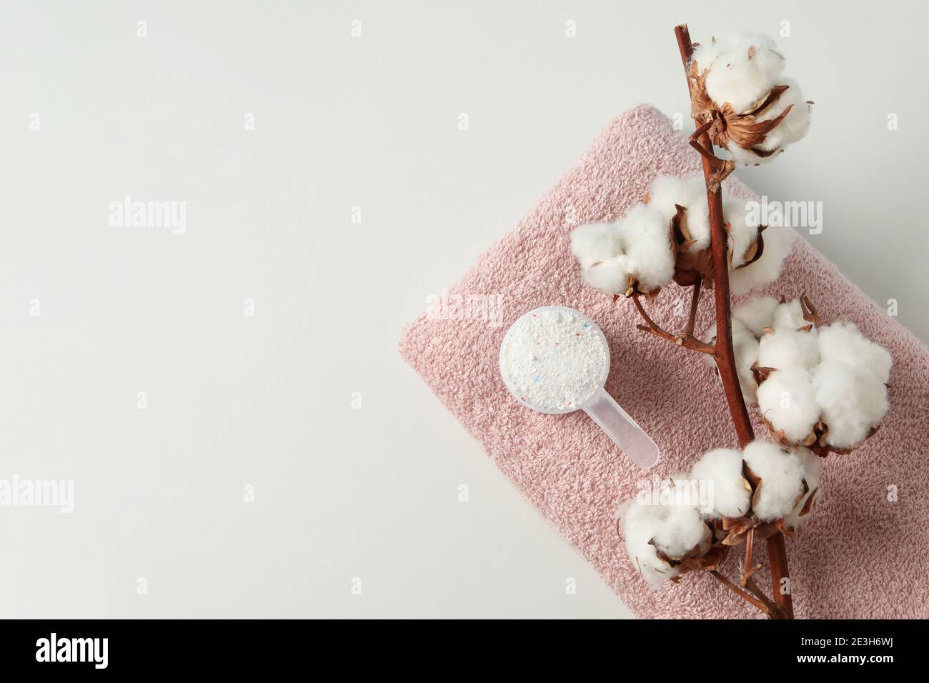 Scoop with washing powder, cotton and towel on white background Stock ...