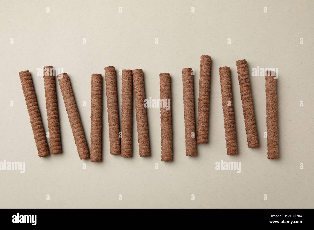 Chocolate wafer rolls on gray background, top view Stock Photo - Alamy
