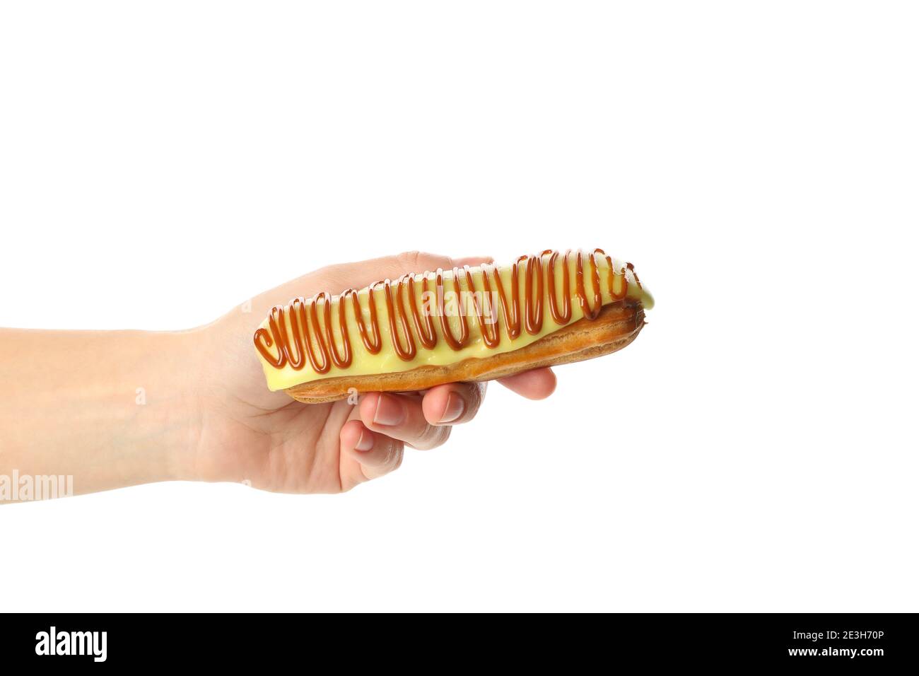 Female hand hold tasty eclair, isolated on white background Stock Photo ...