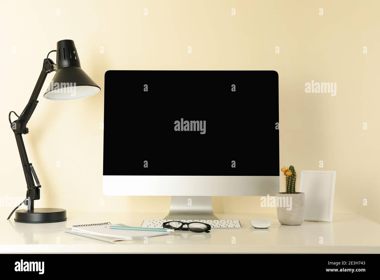 Workplace with desktop computer against beige background Stock Photo ...