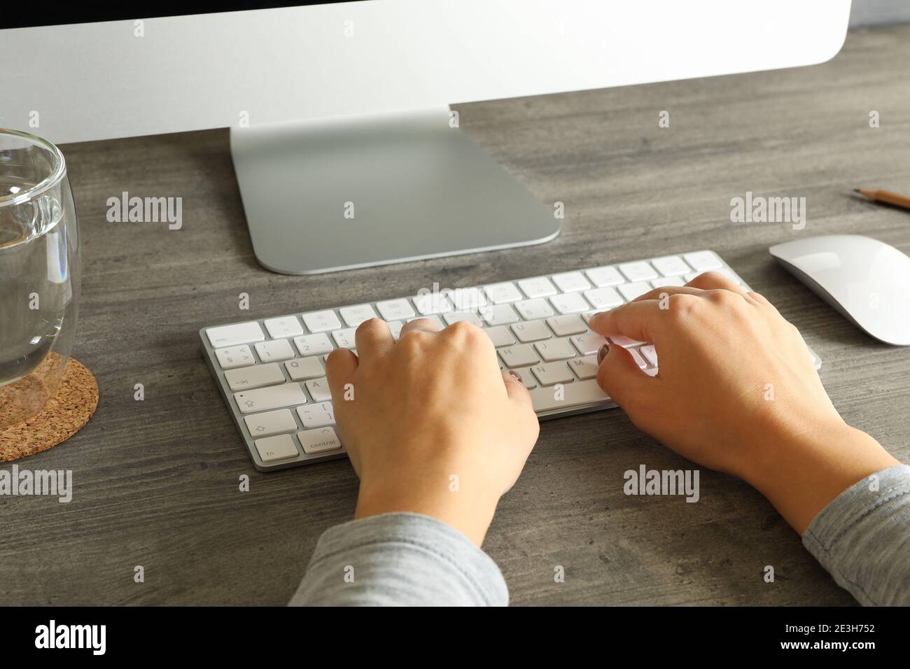 Woman working on desktop computer hi-res stock photography and images ...
