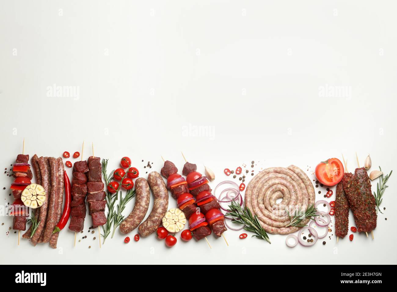 Set of different raw barbecue meat on white background, space for text ...