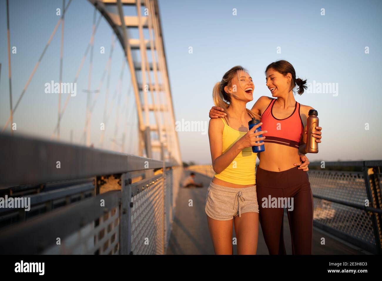Fit happy friends jogging and running together outdoor in city Stock ...