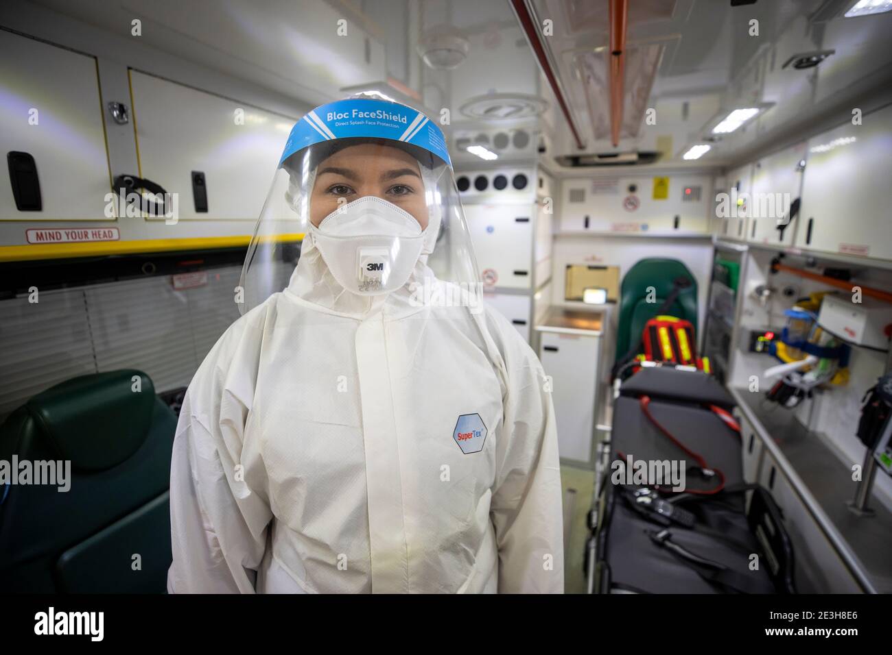 Student EMT Ruth Corscadden wearing full PPE poses during her shift for ...