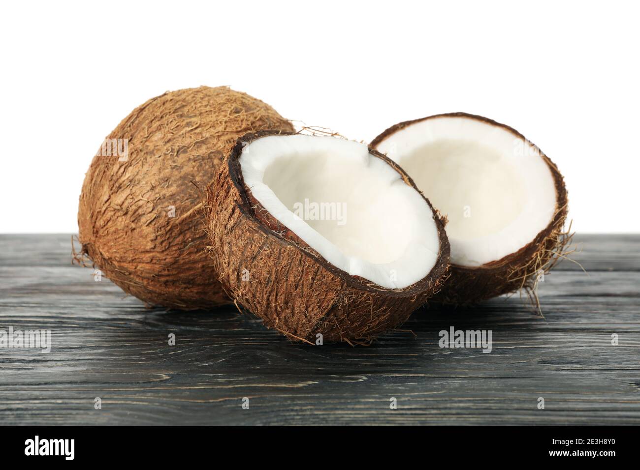 Fresh coconut on wooden table, isolated on white background Stock Photo ...