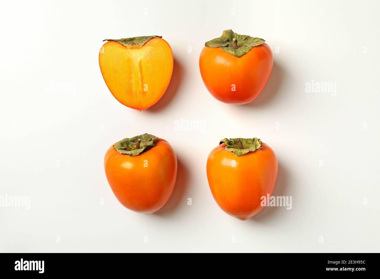 Flat lay with ripe persimmon on white background Stock Photo - Alamy