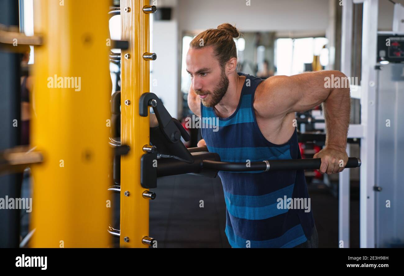 Strong man exercising gym muscular sport hi-res stock photography and ...