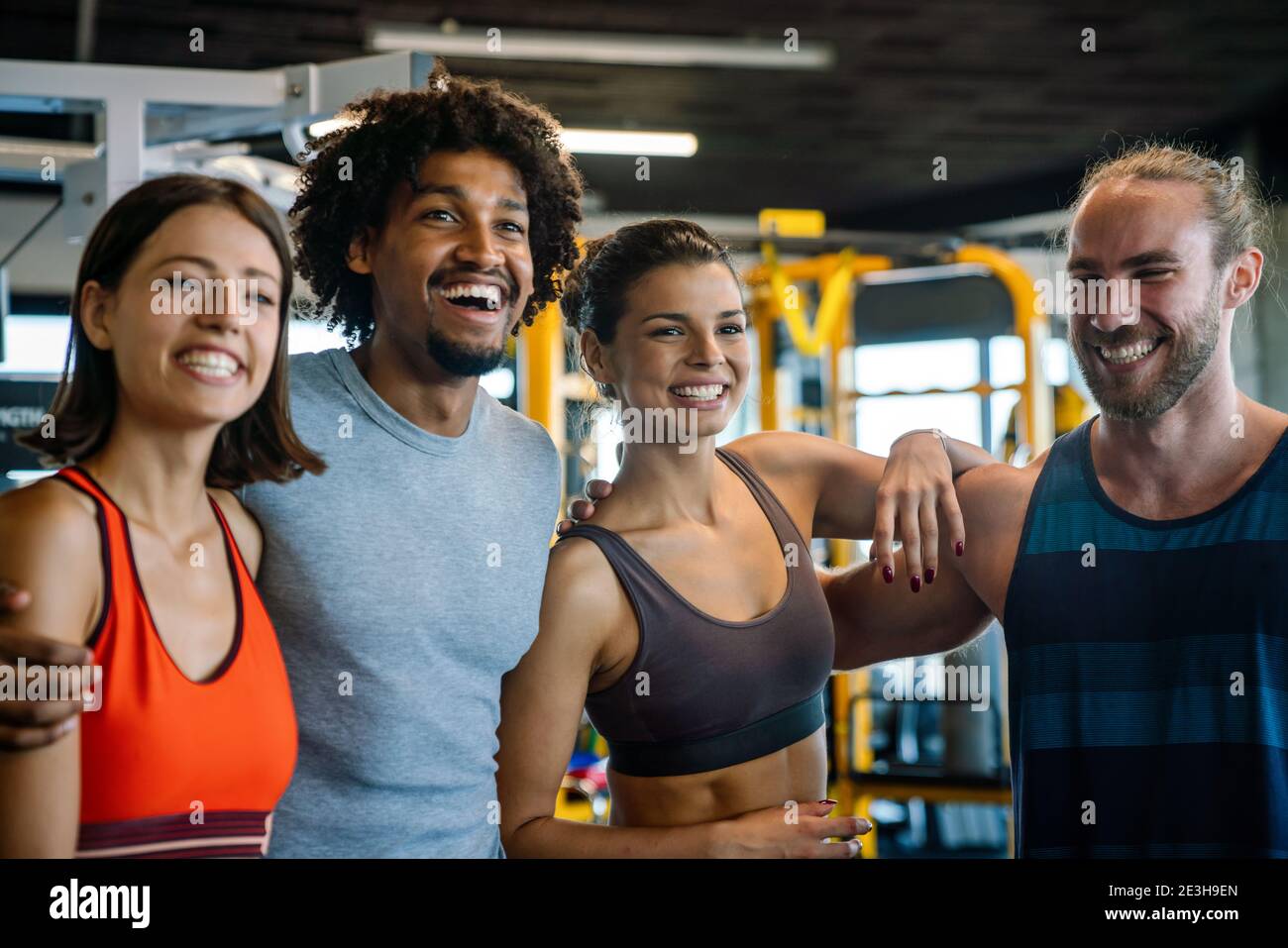 Sport gym exercise and people concept. Happy fit people working out in gym Stock Photo - Alamy
