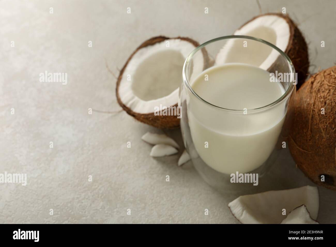 Fresh coconut and coconut milk on white background Stock Photo - Alamy