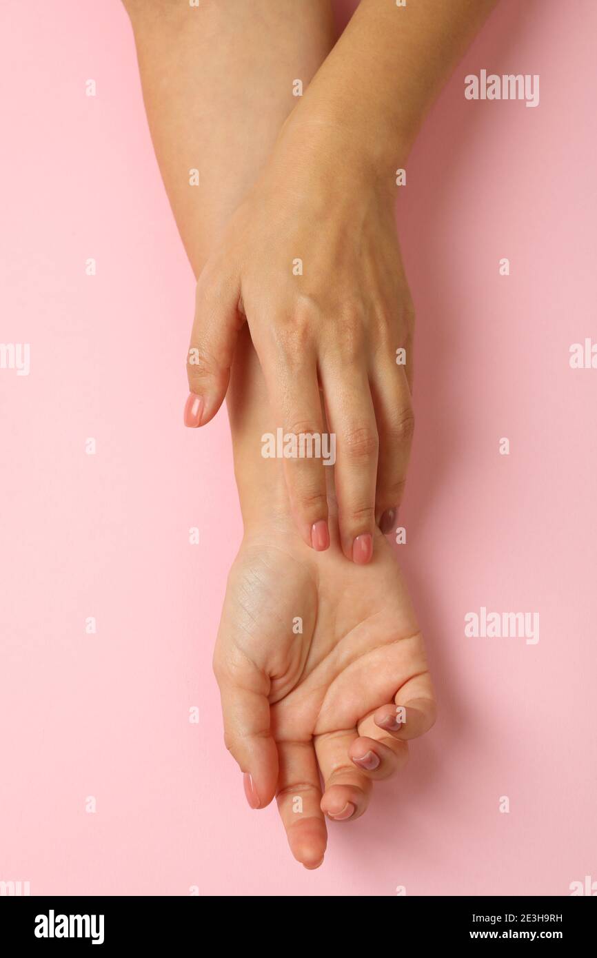 Cute female hands on pink background, top view Stock Photo - Alamy
