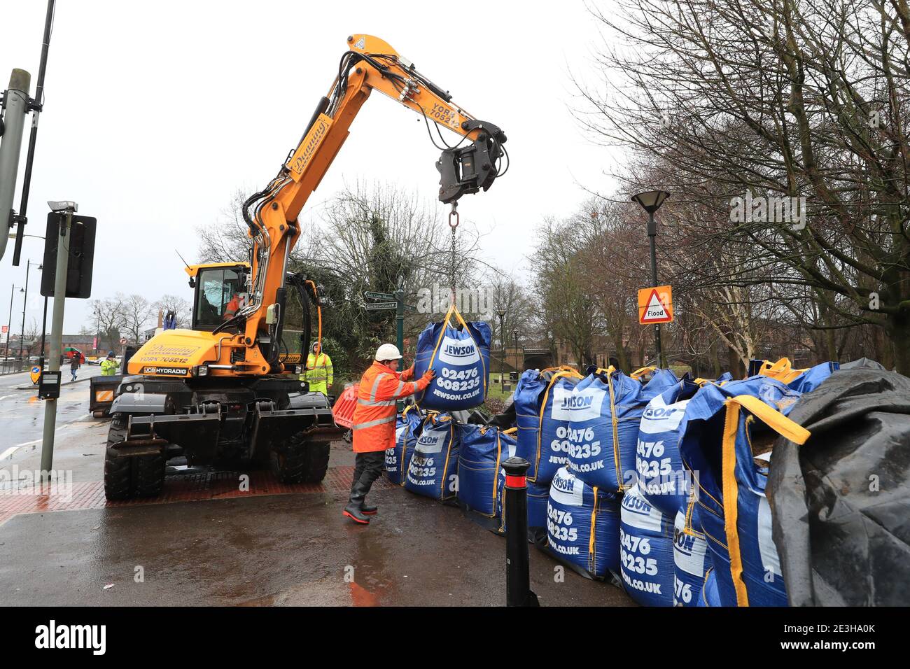 Workmen prepare flood defences near the River Ouse, York, as Storm ...